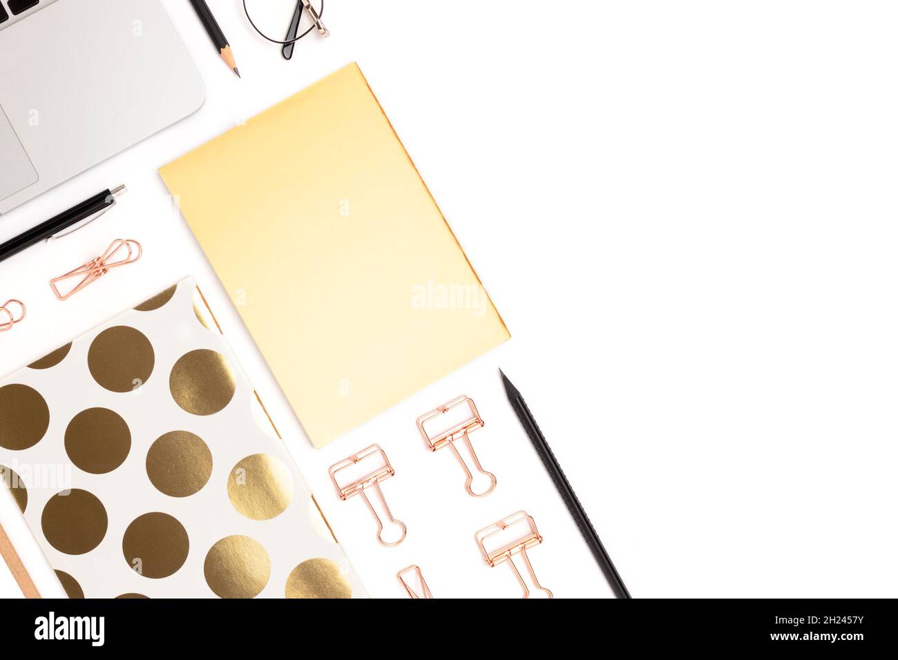 Layout of office supplies and laptop on a white background. Workspace ...