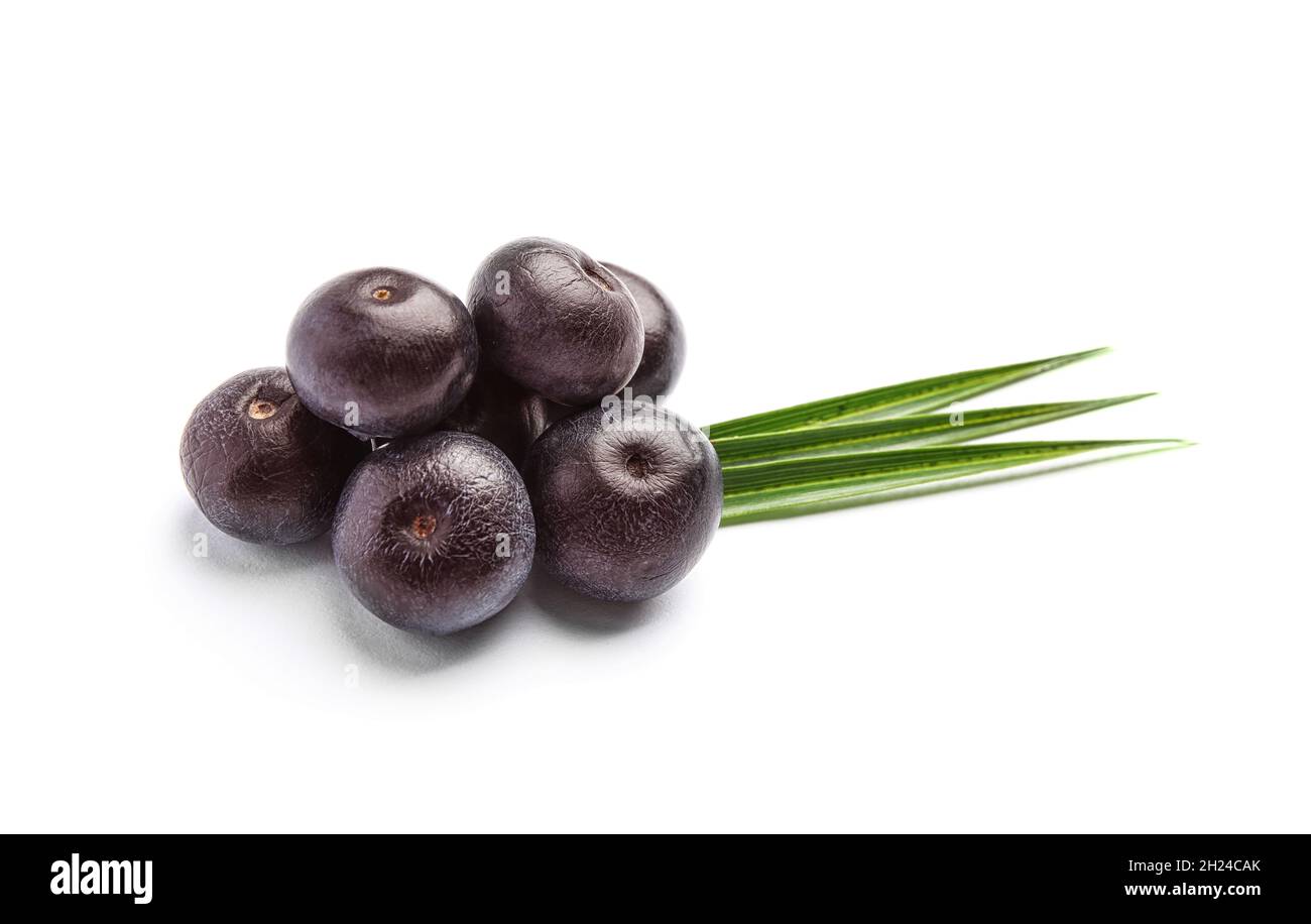Fresh acai berries with leaves on white background Stock Photo - Alamy