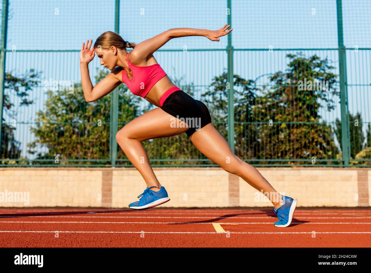 Runner sprinting towards success on run path running athletic track ...