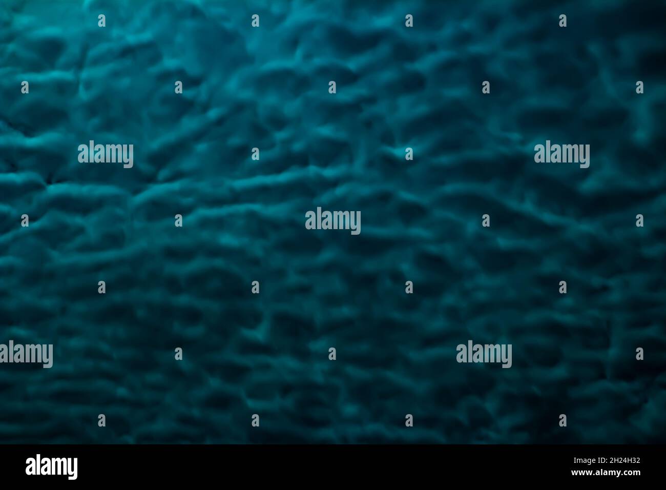 Abstract teal colored background with textures of different shades of ...