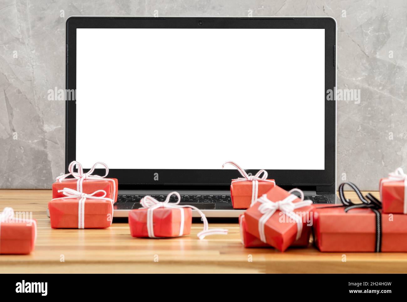 Close up photo of multiple gift boxes on laptop. Love, gift and present ...