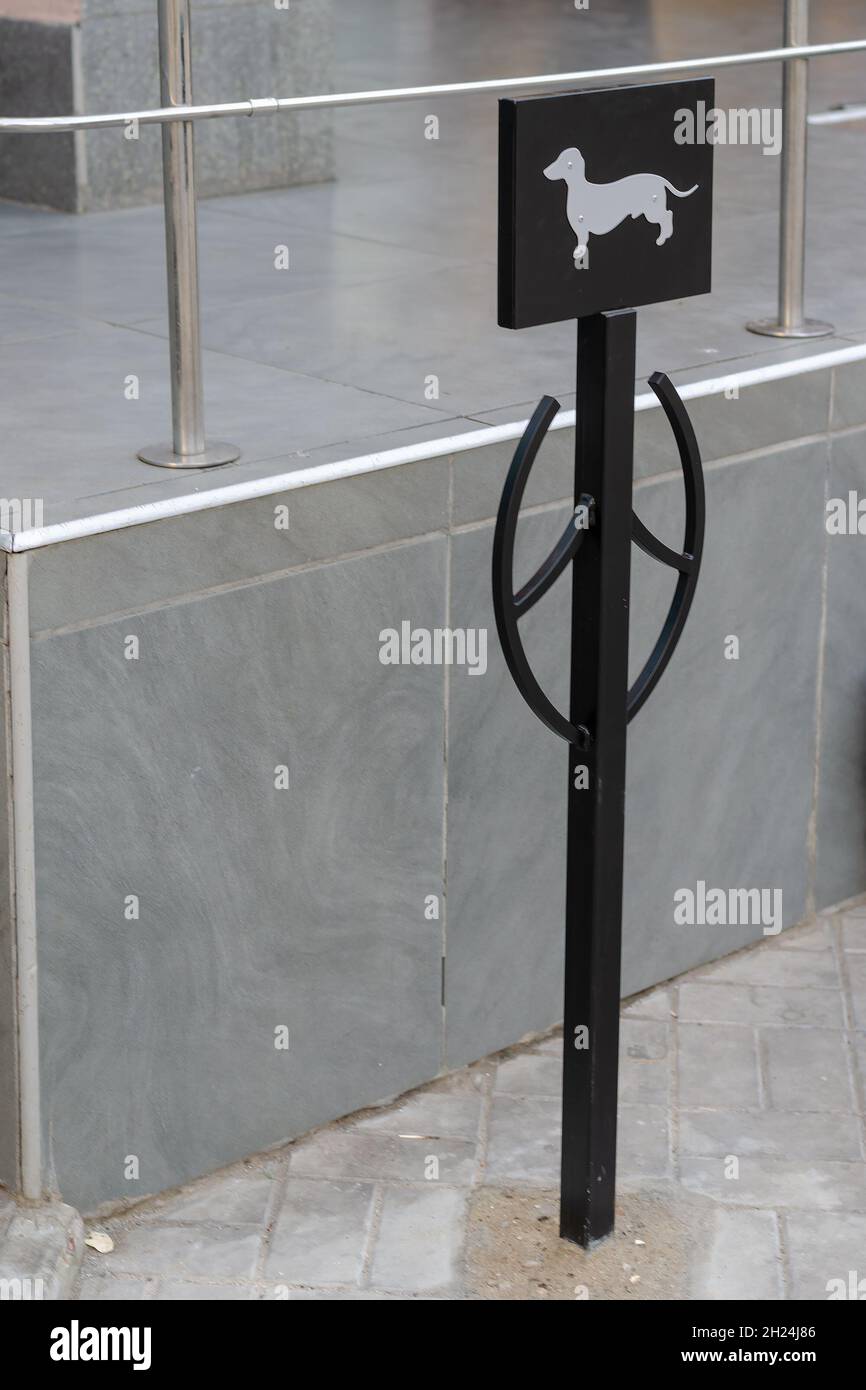 Dog parking sign area of shopping mall. A white silhouette of a ...