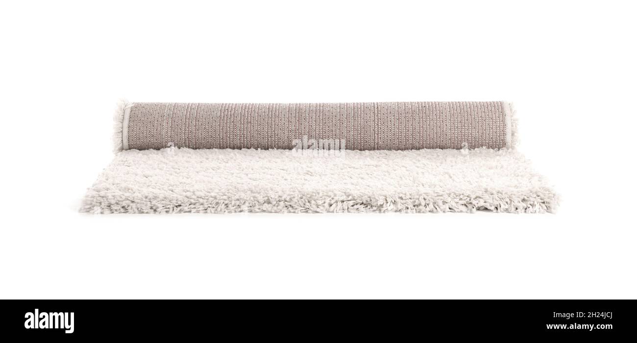 Rolled fuzzy carpet on white background. Interior element Stock Photo ...
