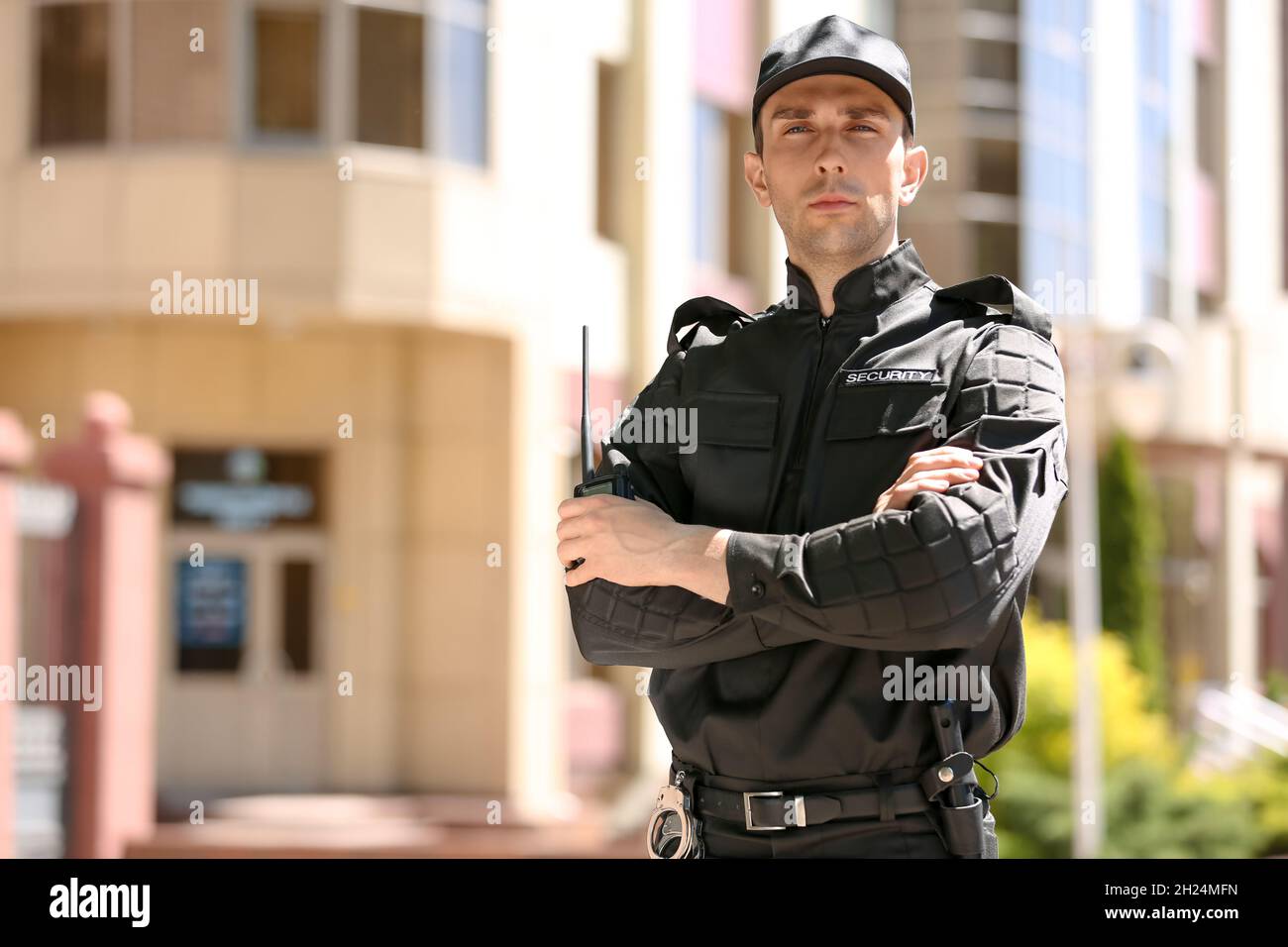 Portrait of male security guard in uniform outdoors Stock Photo - Alamy