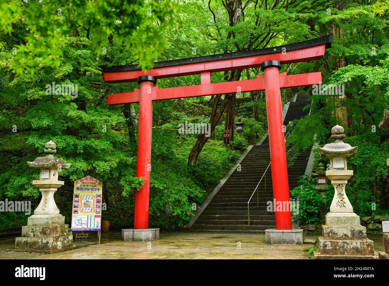 Nara, Japan - 01 July 2019: Red torii gate at entrance to Tanzan Jinja ...