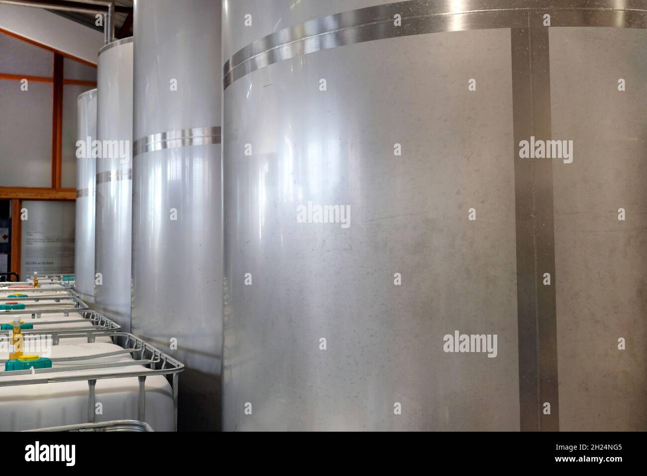 Stainless steel containers in a whisky distillery Stock Photo - Alamy