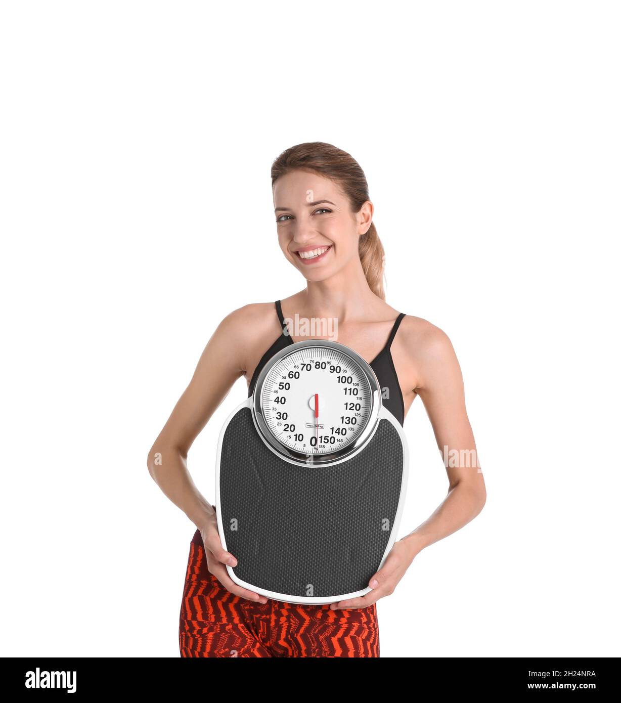 Young beautiful woman with scales on white background. Weight loss ...