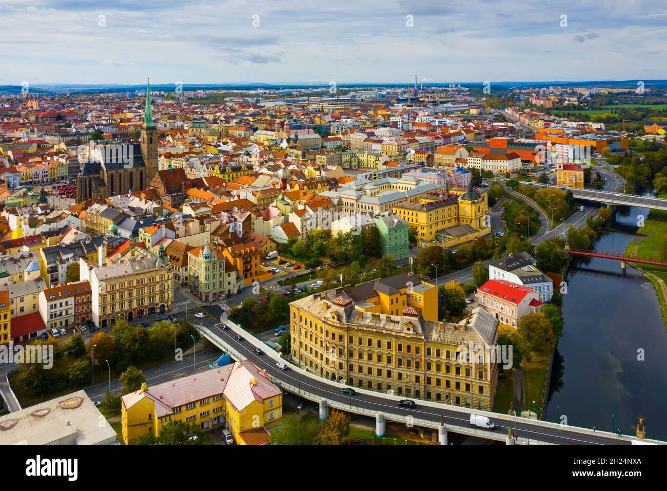 Picturesque aerial view of old buildings of Pilsen cityscape with river ...