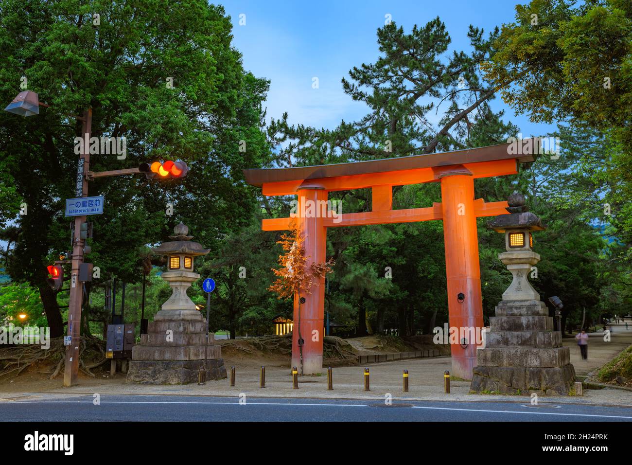 Nara, Japan - 01 July 2019: Red torii gate at entrance to Kasuga Taisha ...