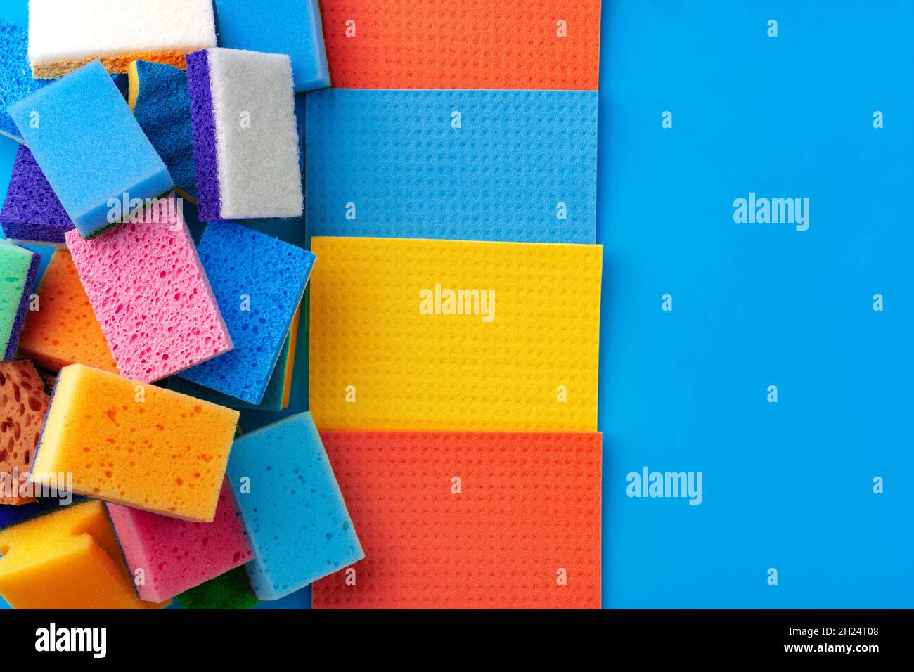 House cleaning supplies on blue color background Stock Photo - Alamy
