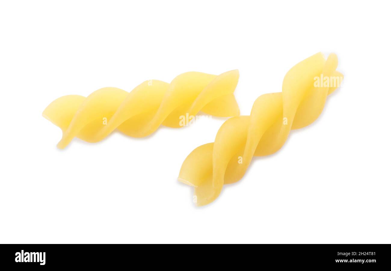 Uncooked fusilli pasta on white background Stock Photo - Alamy