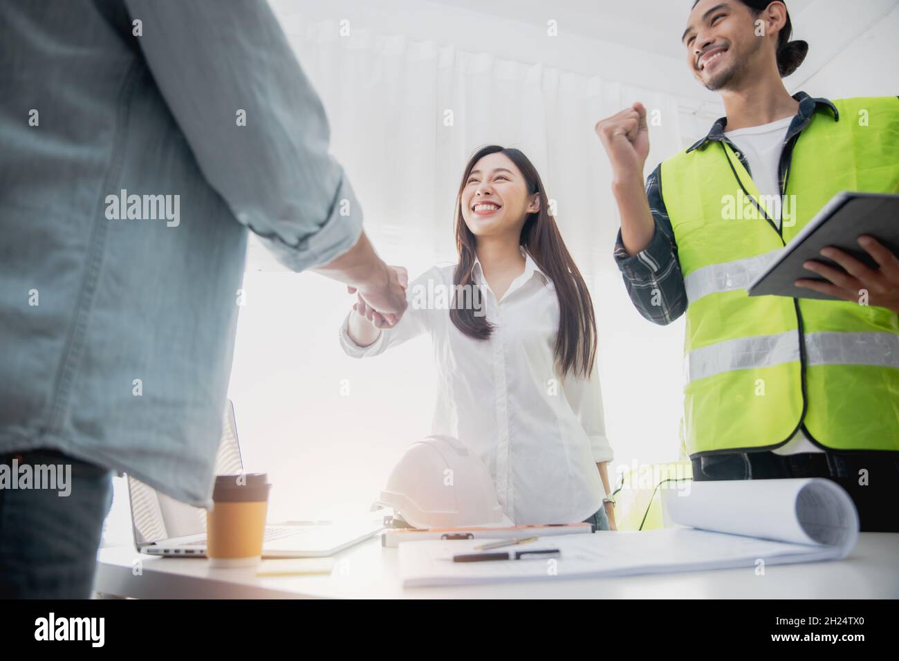 engineer team shake hand after planning and discussing about ...