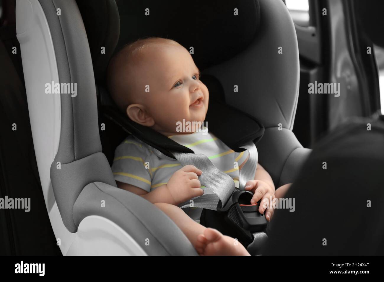 Little baby in child safety seat inside of car Stock Photo - Alamy