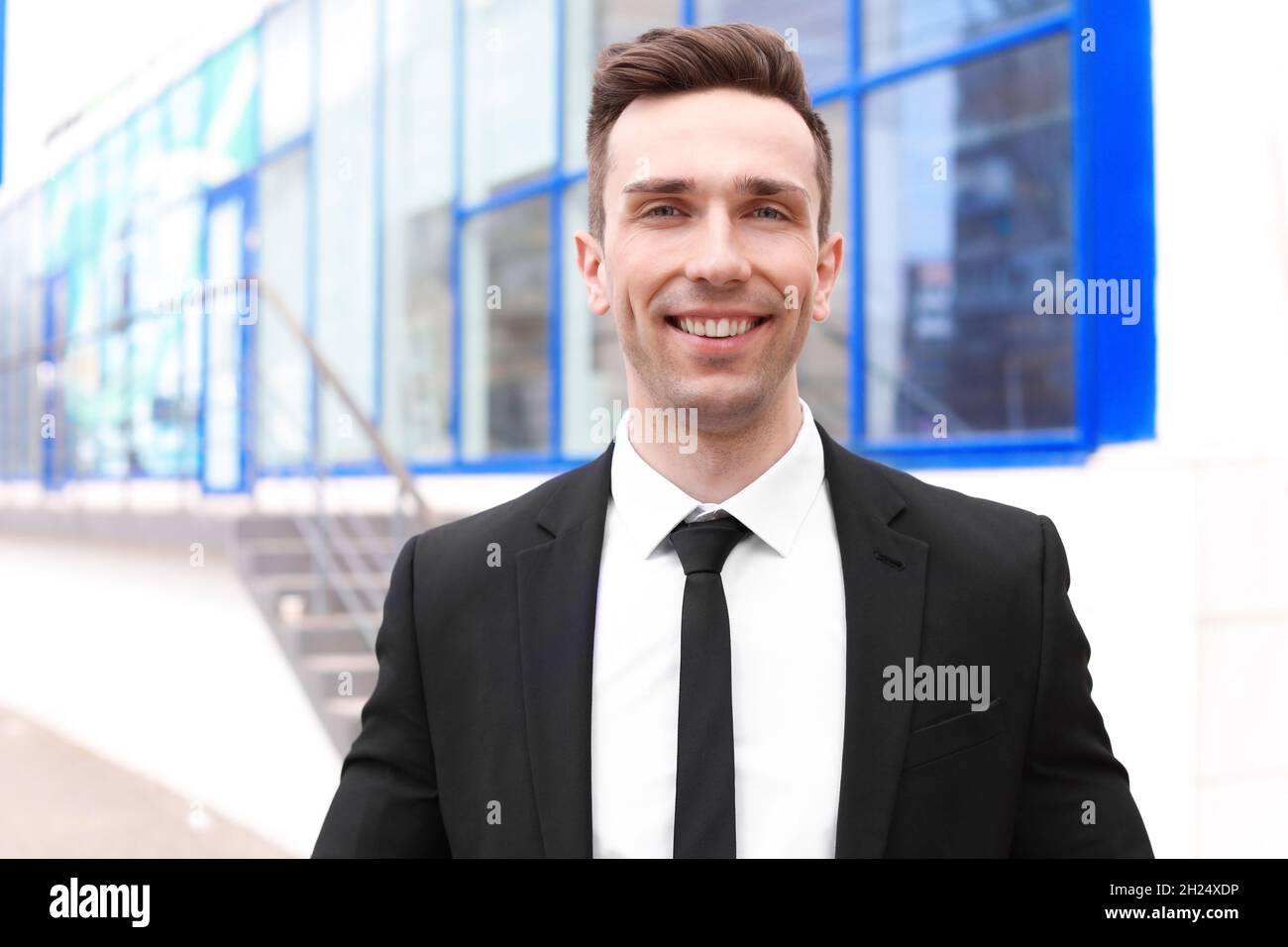 Male real estate agent outdoors Stock Photo - Alamy