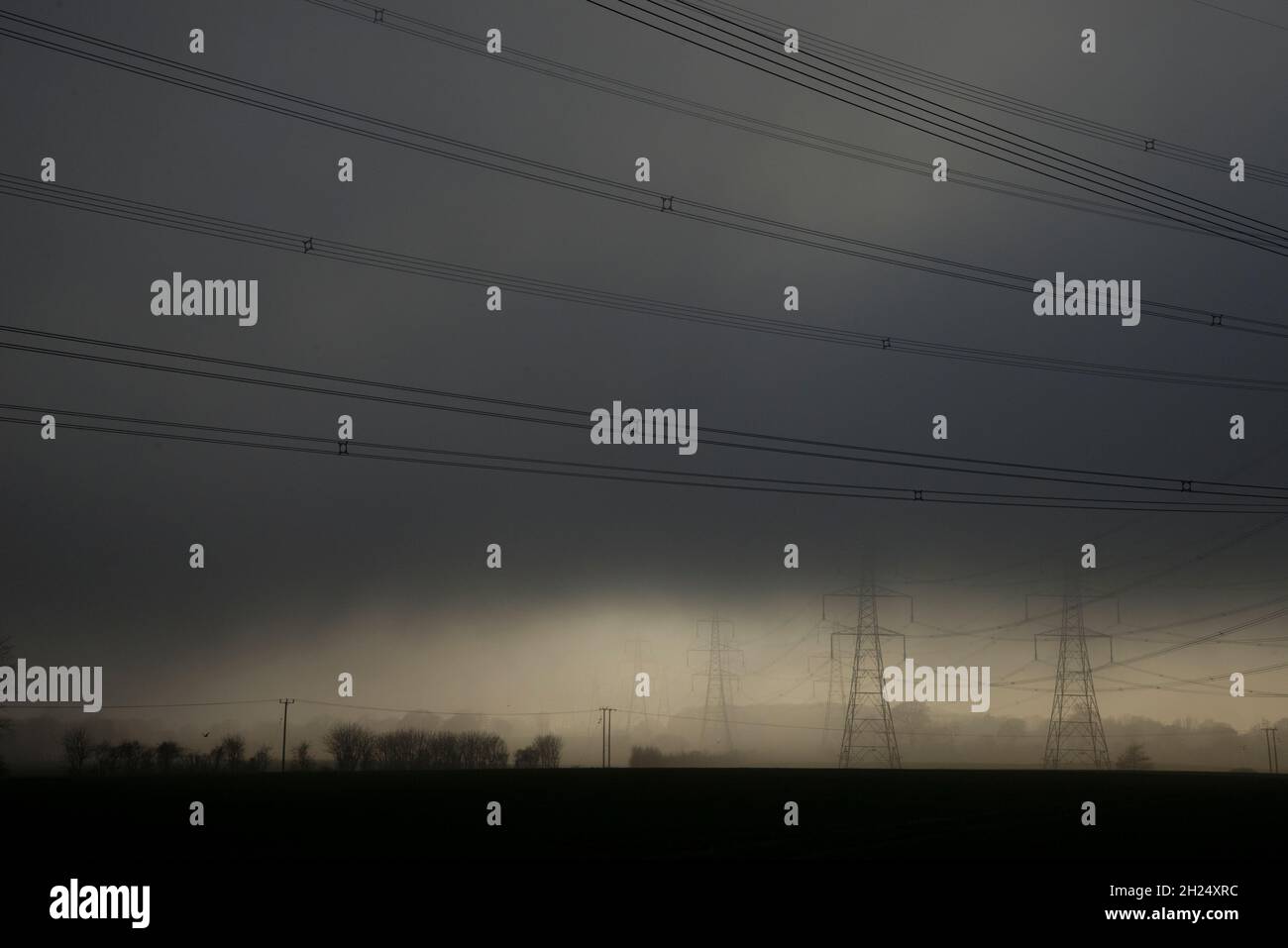 Electricity Pylons in the mist, Sizewell A and B Power Stations Stock ...