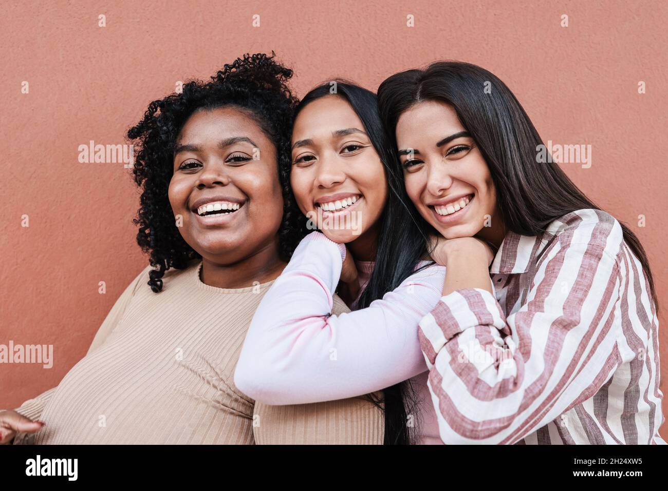Multiracial friends having fun together outdoor - Focus on faces Stock ...