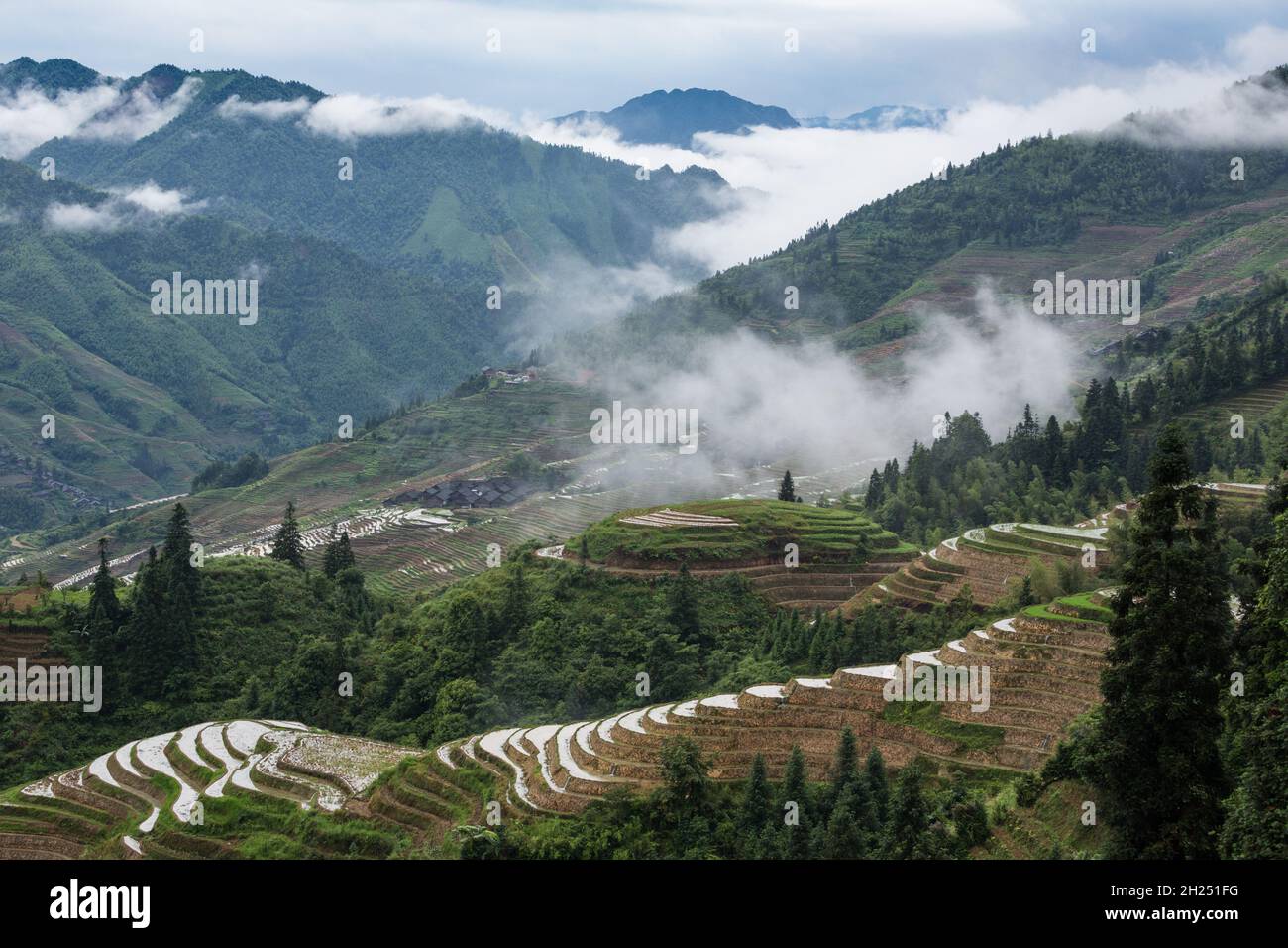A traditional Zhuang ethnic minority village on the hillside of the ...