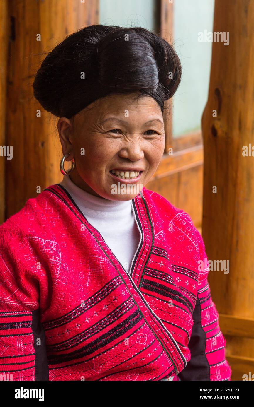 A woman of the Red Yao ethnic minority in traditional attire at the ...