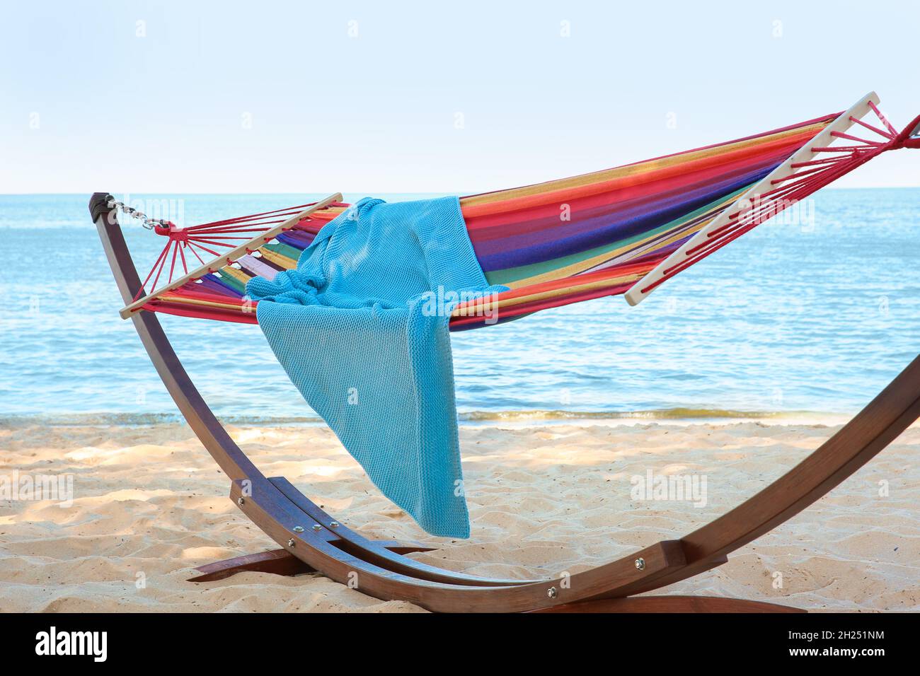 Colorful hammock with blanket at seaside. Summer vacation Stock Photo ...