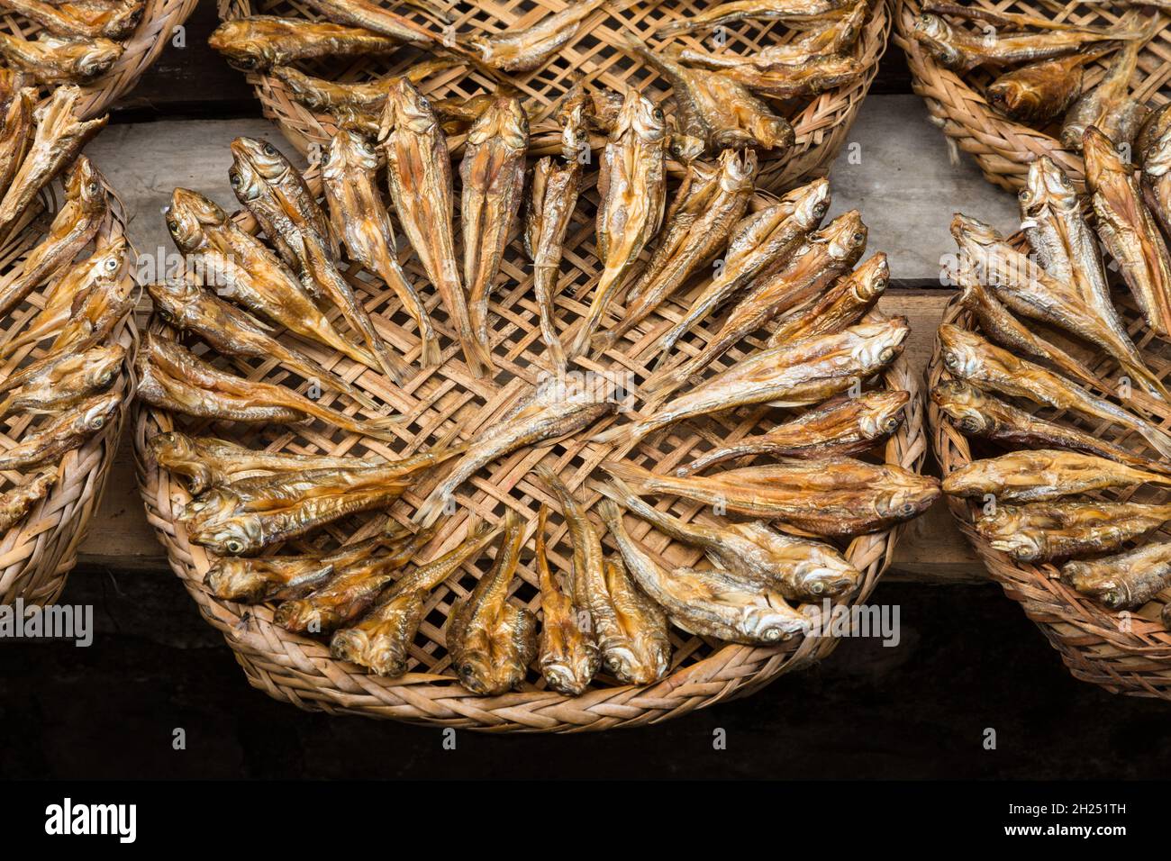Baskets of dried fish for sale on the street in the ancient town of ...