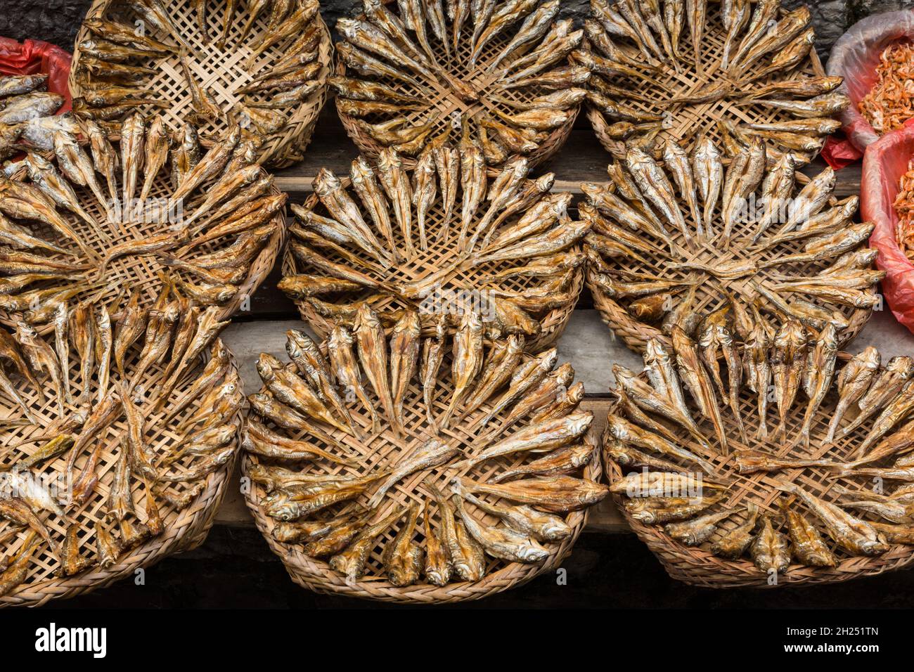 Baskets of dried fish for sale on the street in the ancient town of ...