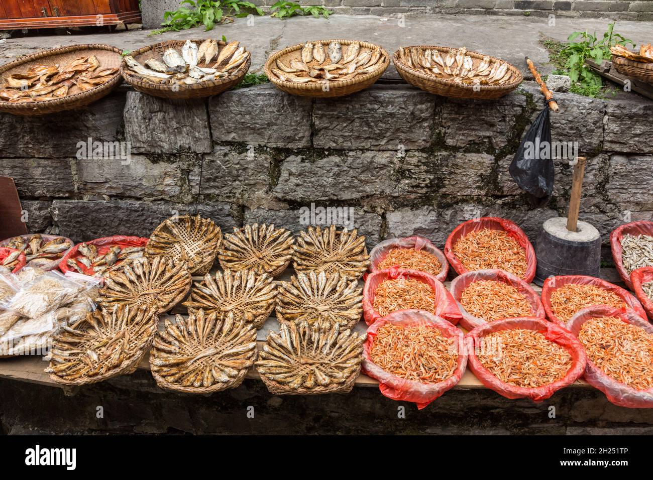 Baskets of dried fish and shrimp for sale on the street in the ancient ...