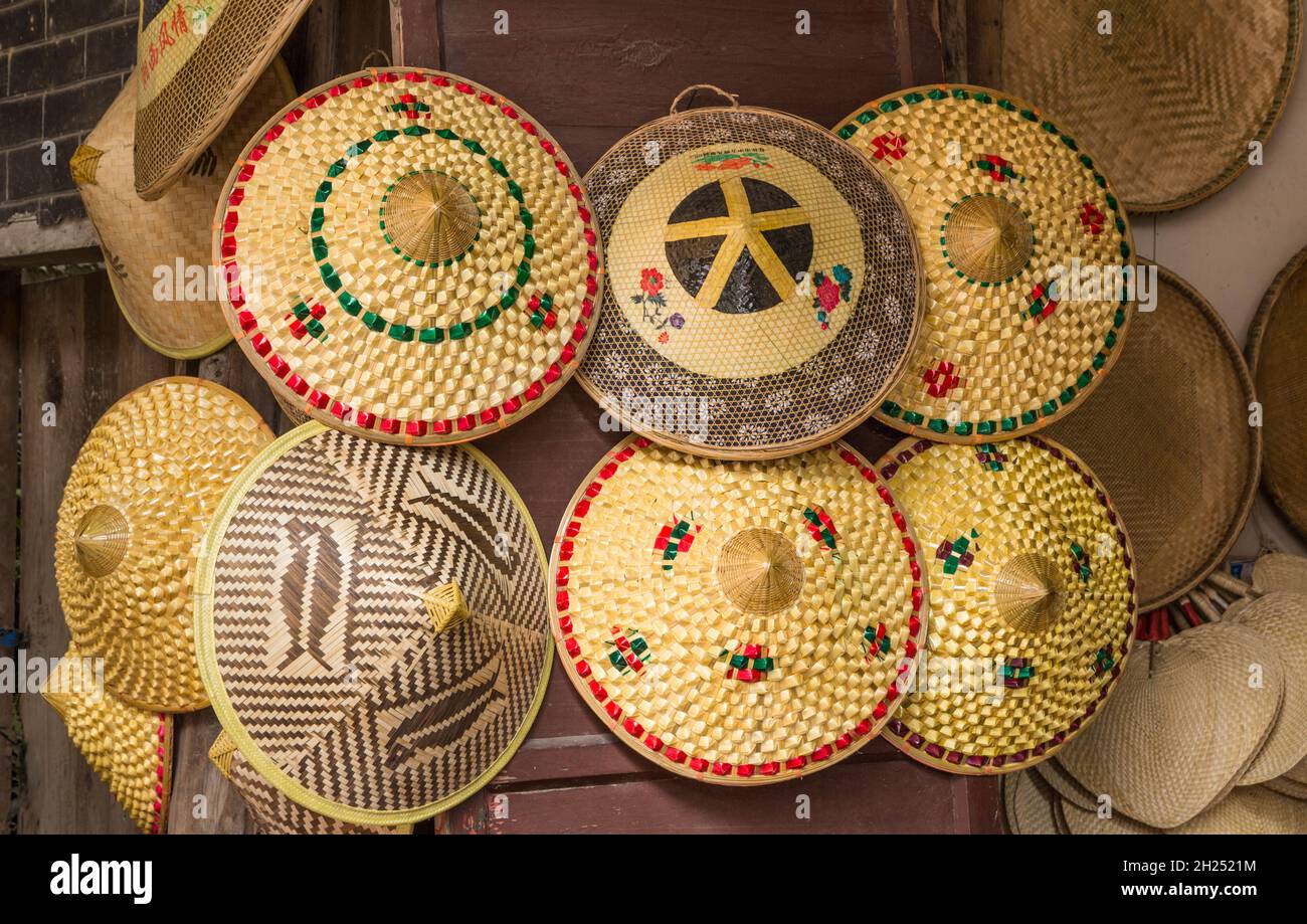 Traditional woven bamboo conical hats for sale on the street in the ...