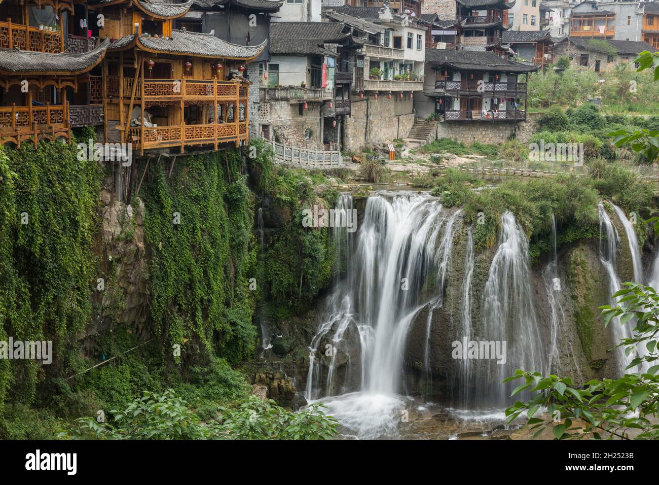 The Wangcun Waterfall separates the ancient town of Furong in Hunan ...