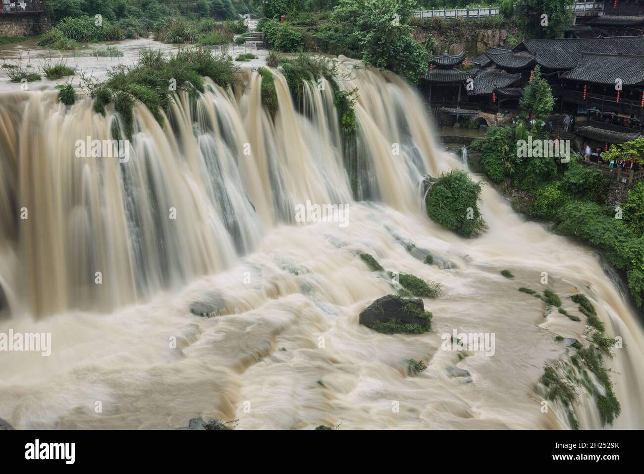 The Wangcun Waterfall separates the ancient town of Furong in Hunan ...