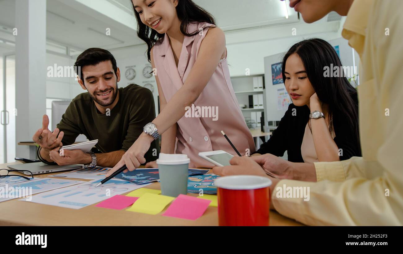 business team people working in office looking at graph paper and ...
