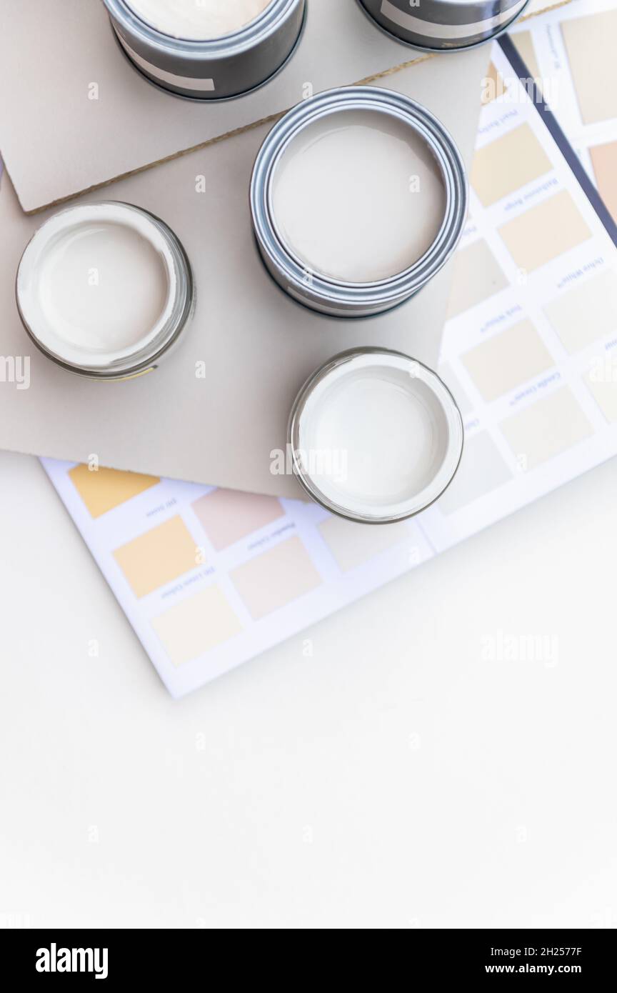Tiny sample paint cans during house renovation, process of choosing ...