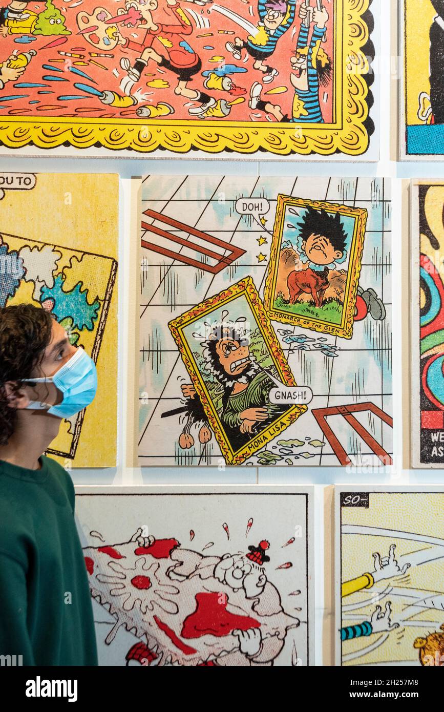 London, UK. 20 October 2021. A visitor views a wall of extracts from ...