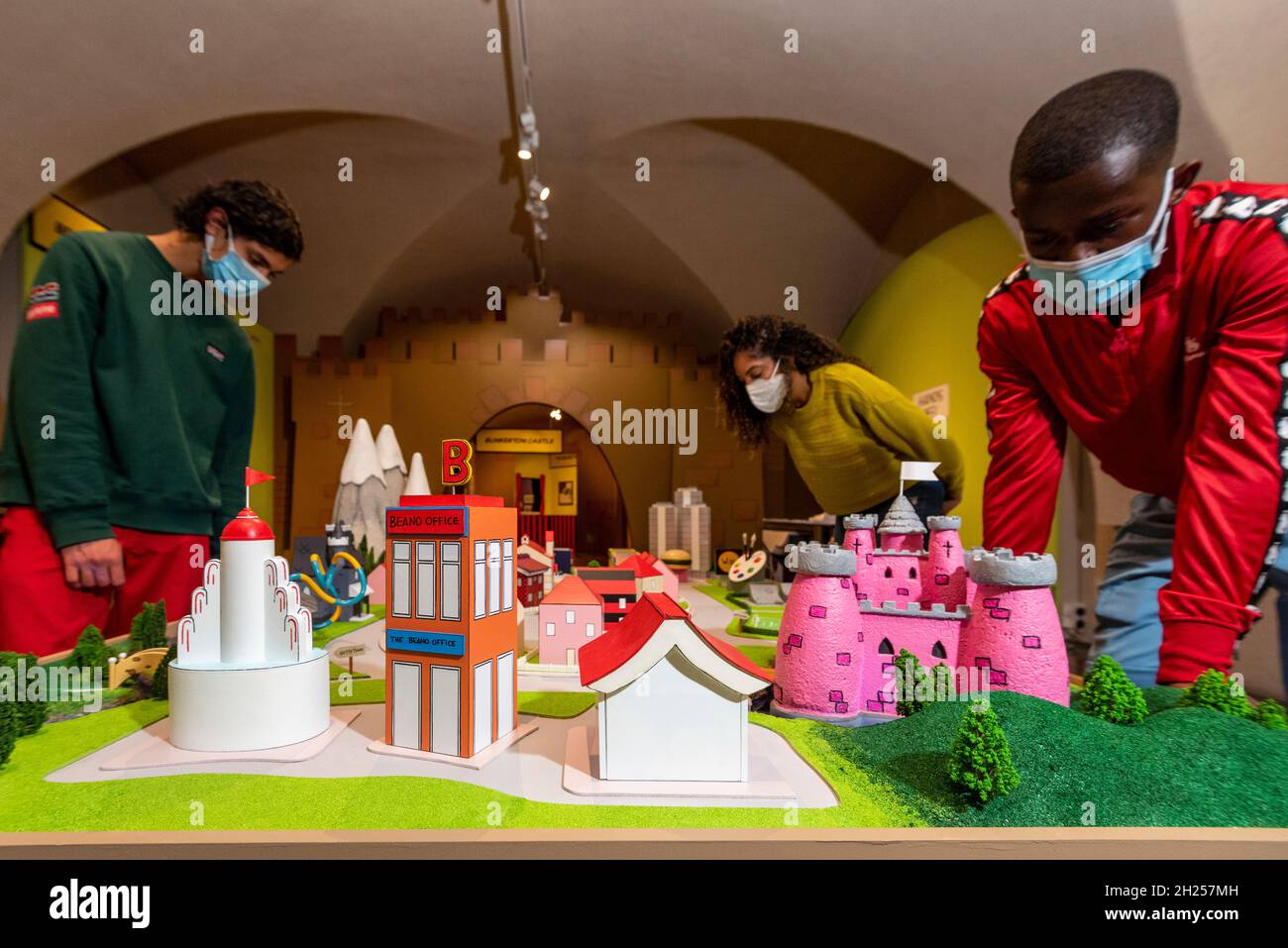 London, UK. 20 October 2021. Visitors view a "Scale Model of Village of ...