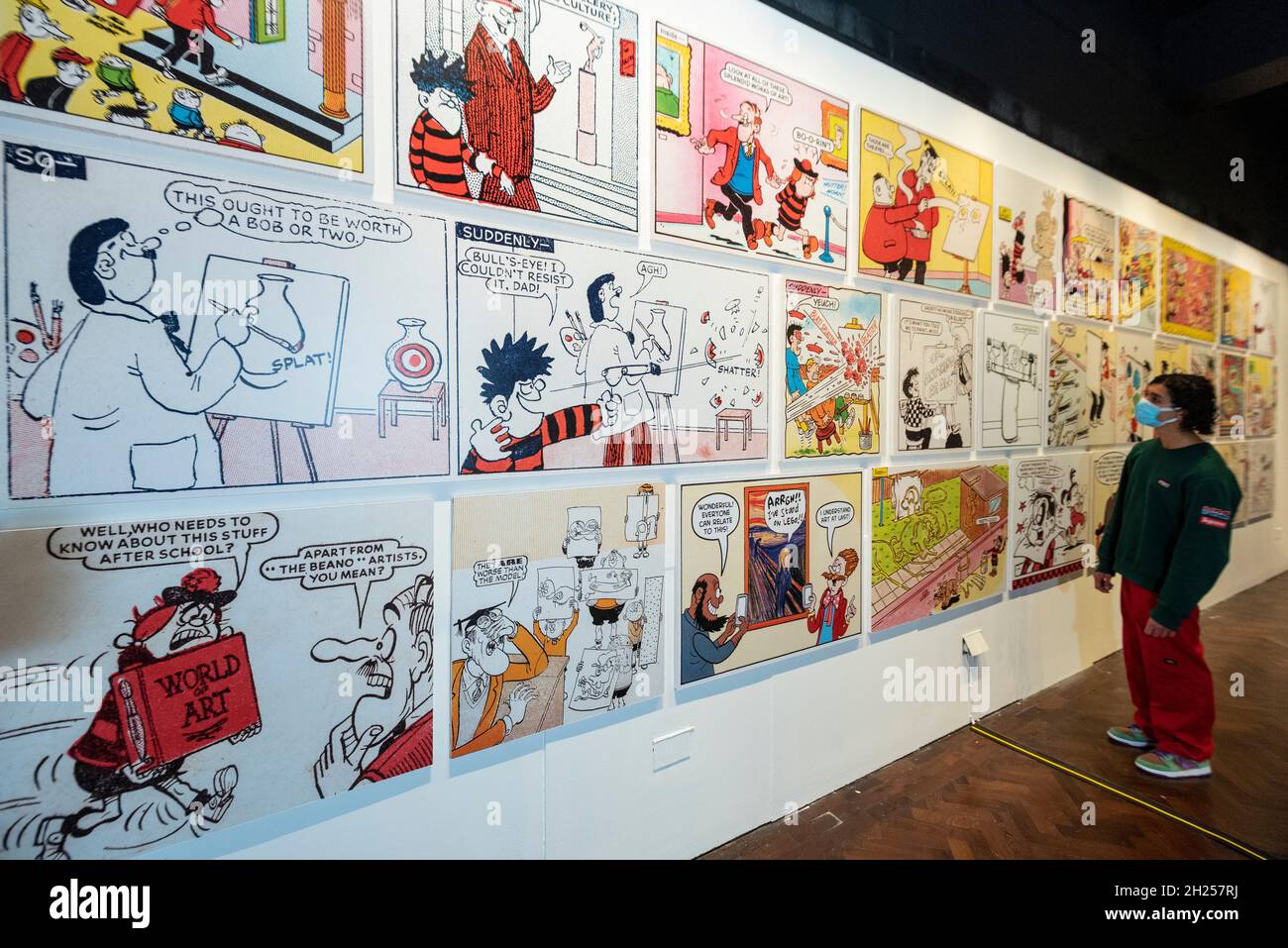 London, UK. 20 October 2021. A visitor views a wall of extracts from ...