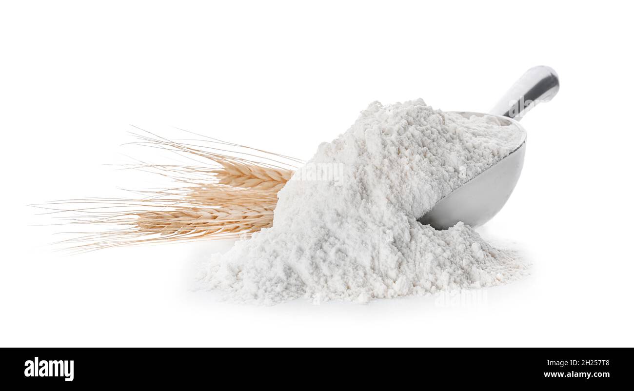 Scoop with flour on white background Stock Photo - Alamy