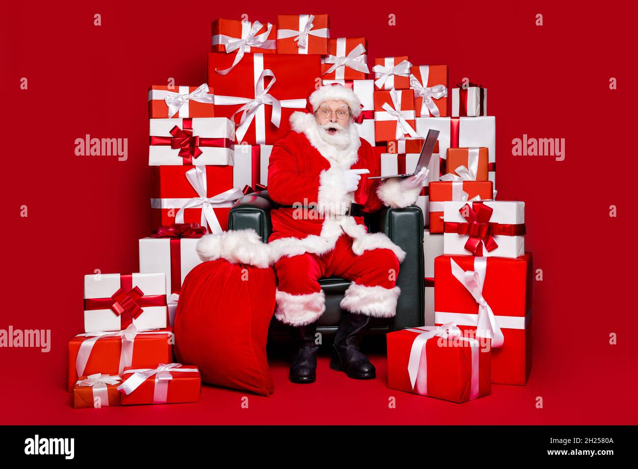 Photo of cheerful impressed retired man wear santa claus costume ...