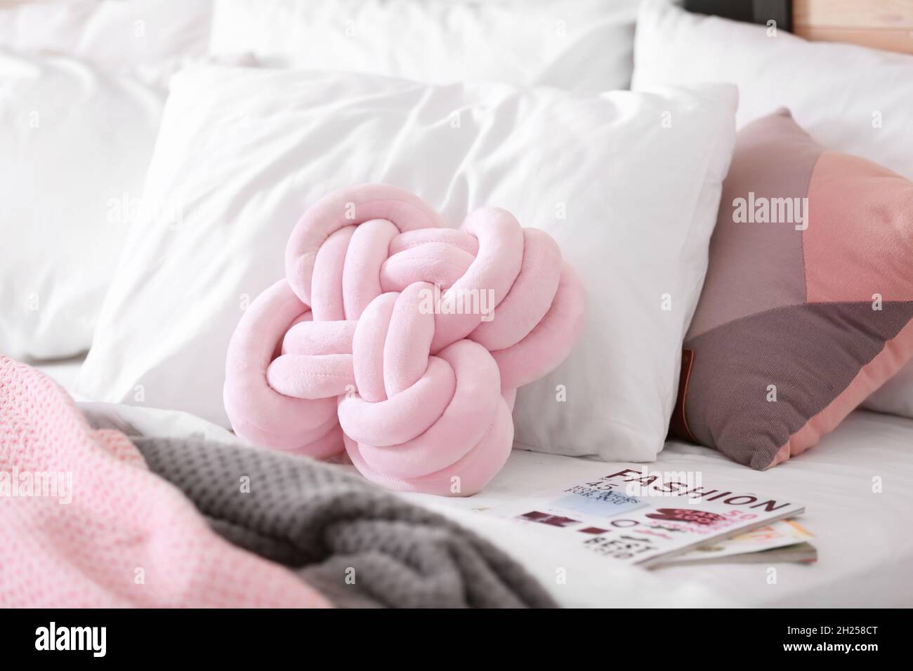 Pillows and magazines on bed. Idea for interior design Stock Photo - Alamy