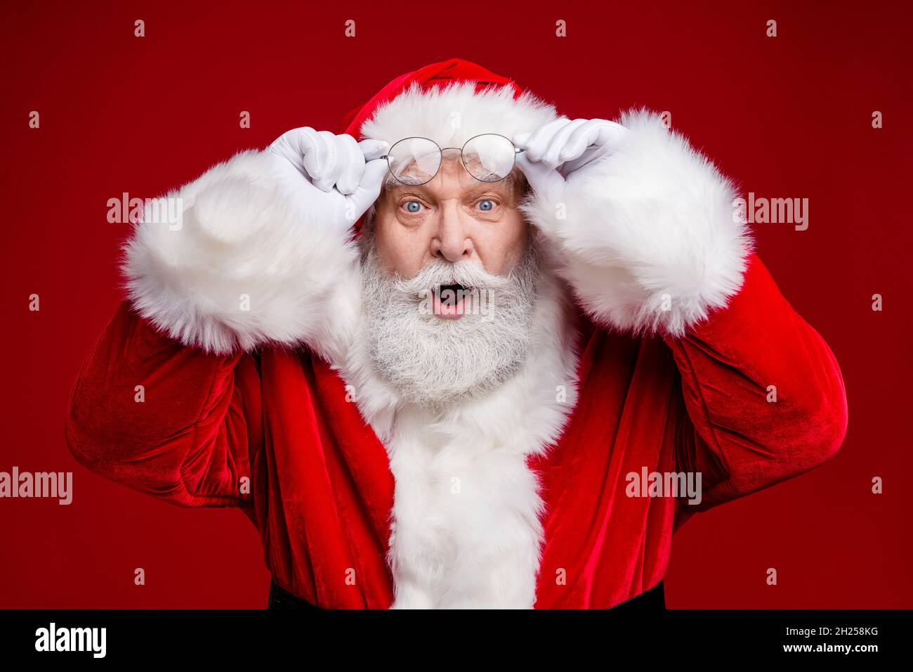 Photo of amazed surprised retired man wear santa claus costume arms ...