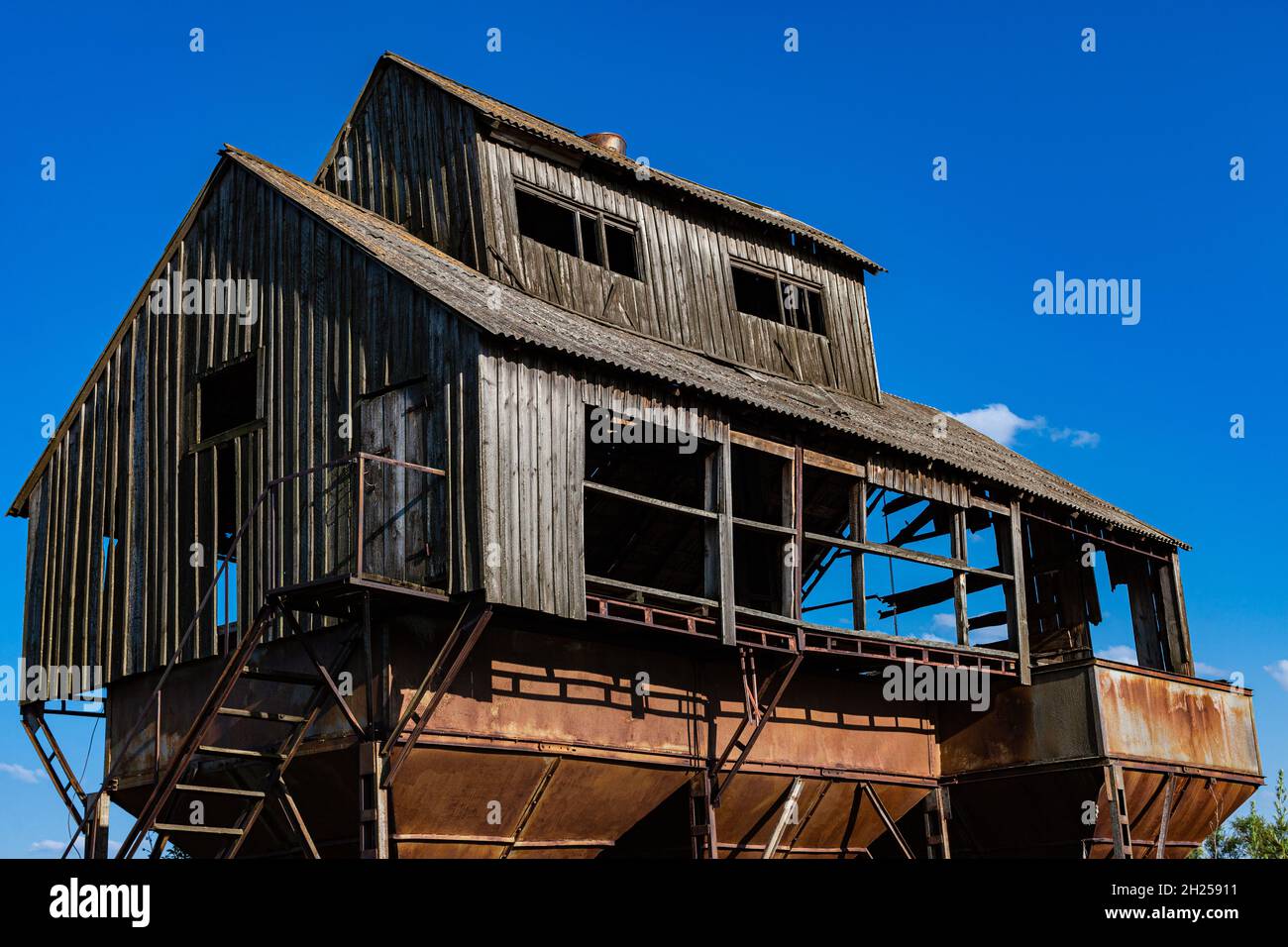 old abandoned grain storage current against the blue sky . High quality ...