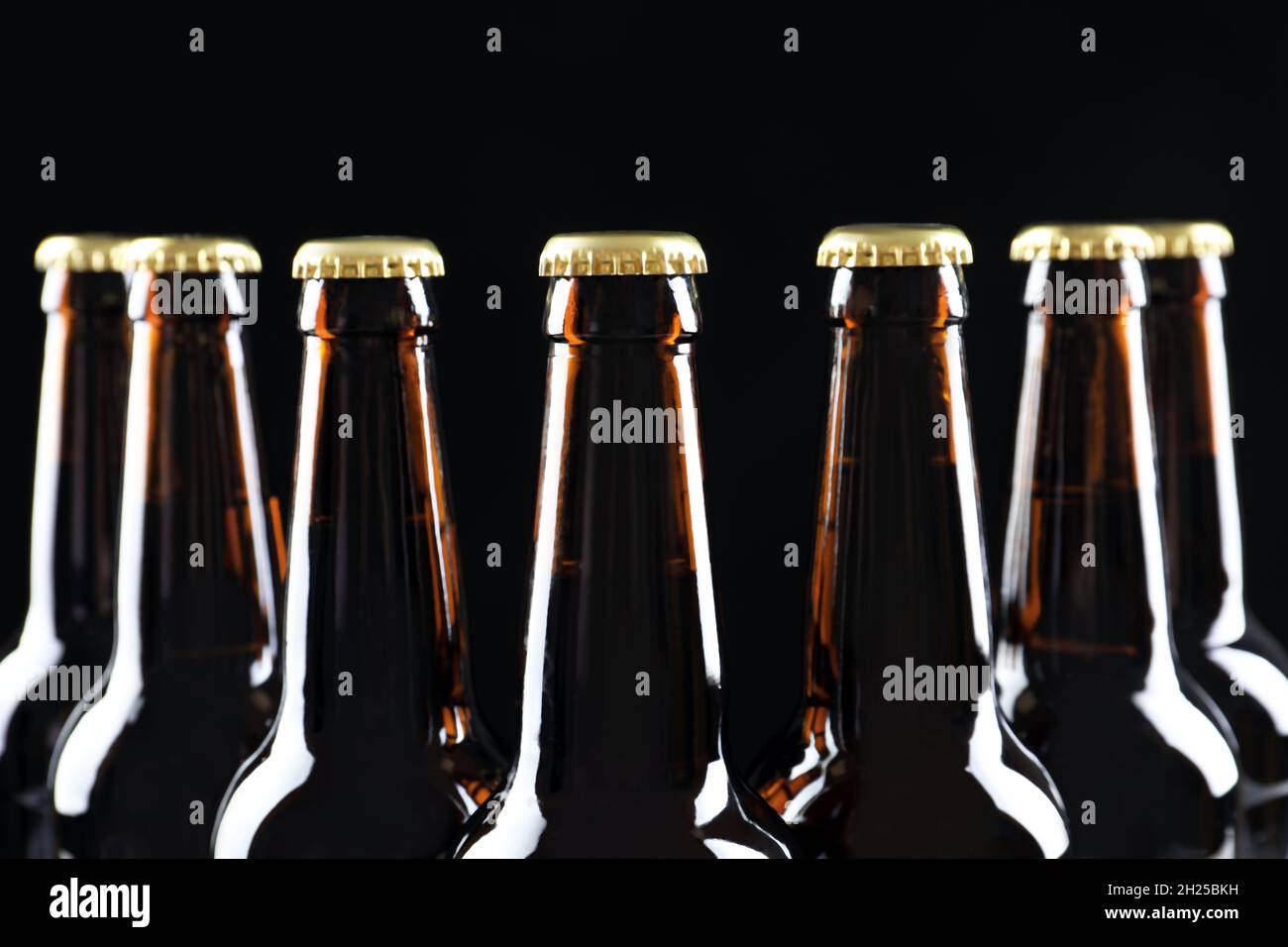 Many bottles of beer on dark background Stock Photo - Alamy