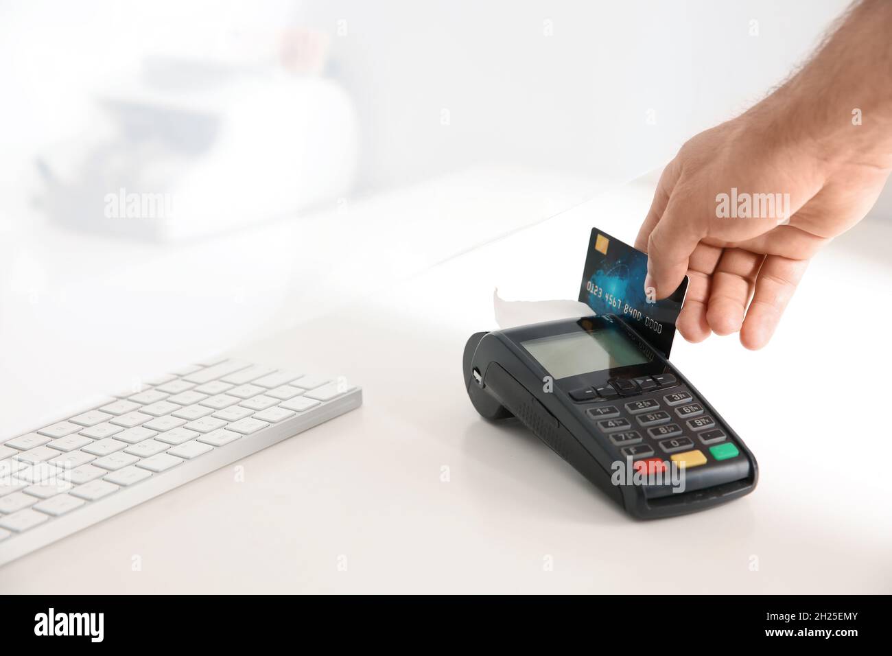 Man using bank terminal for credit card payment at cash department ...