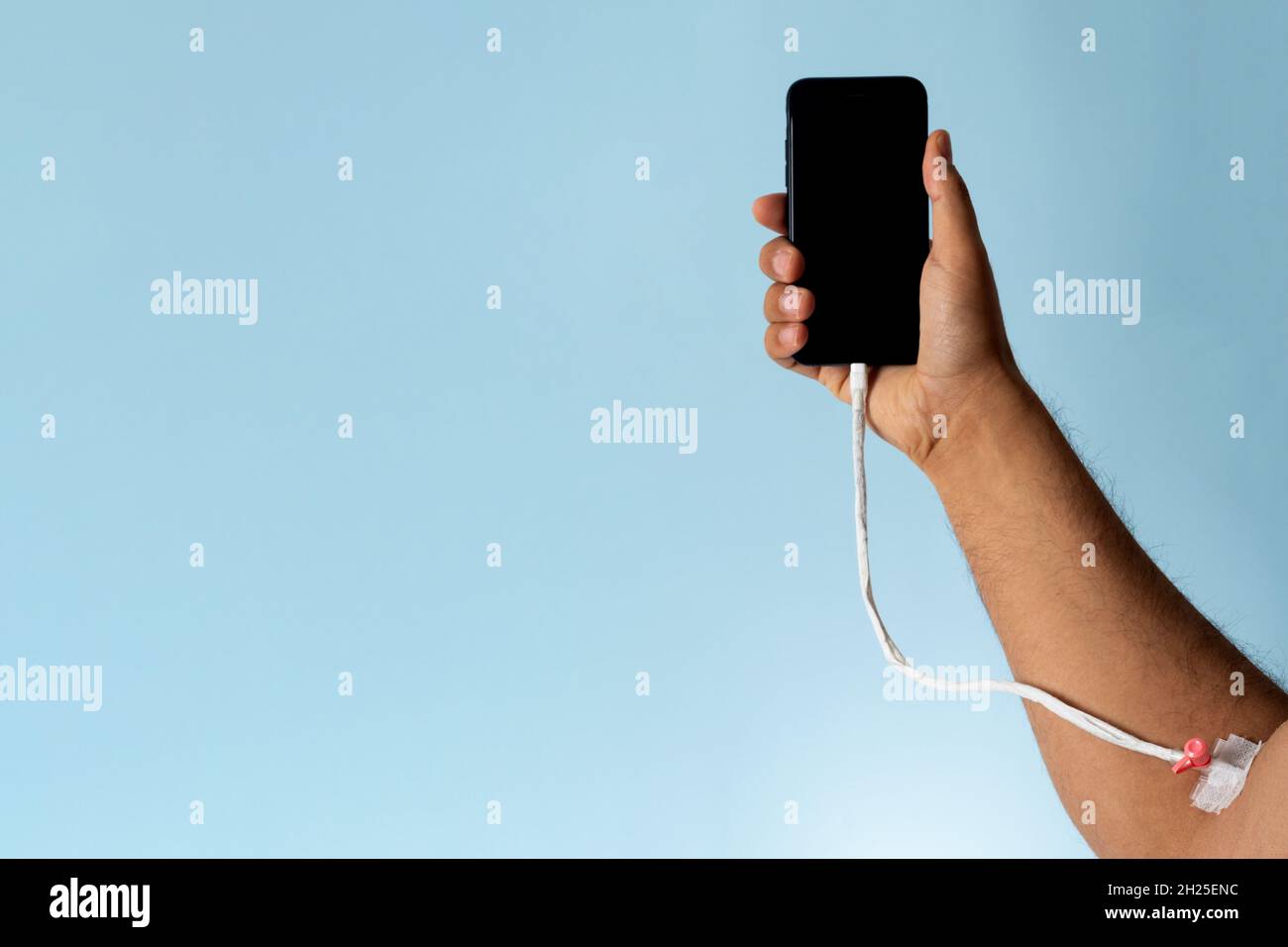 Close up photo of a hand charging mobile phone Stock Photo - Alamy