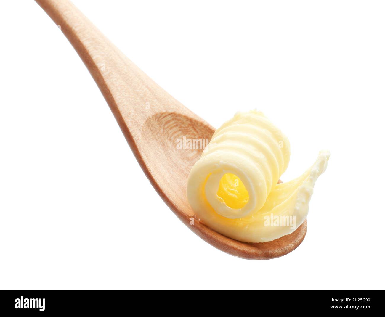 Wooden spoon with butter curl on white background Stock Photo - Alamy