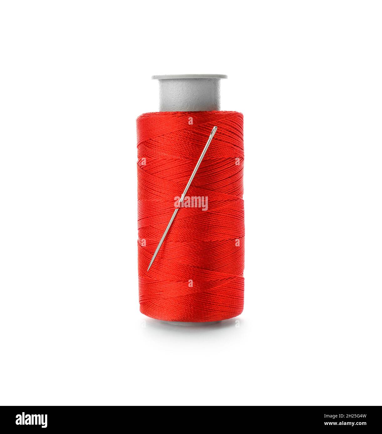 Color sewing thread with needle on white background Stock Photo - Alamy