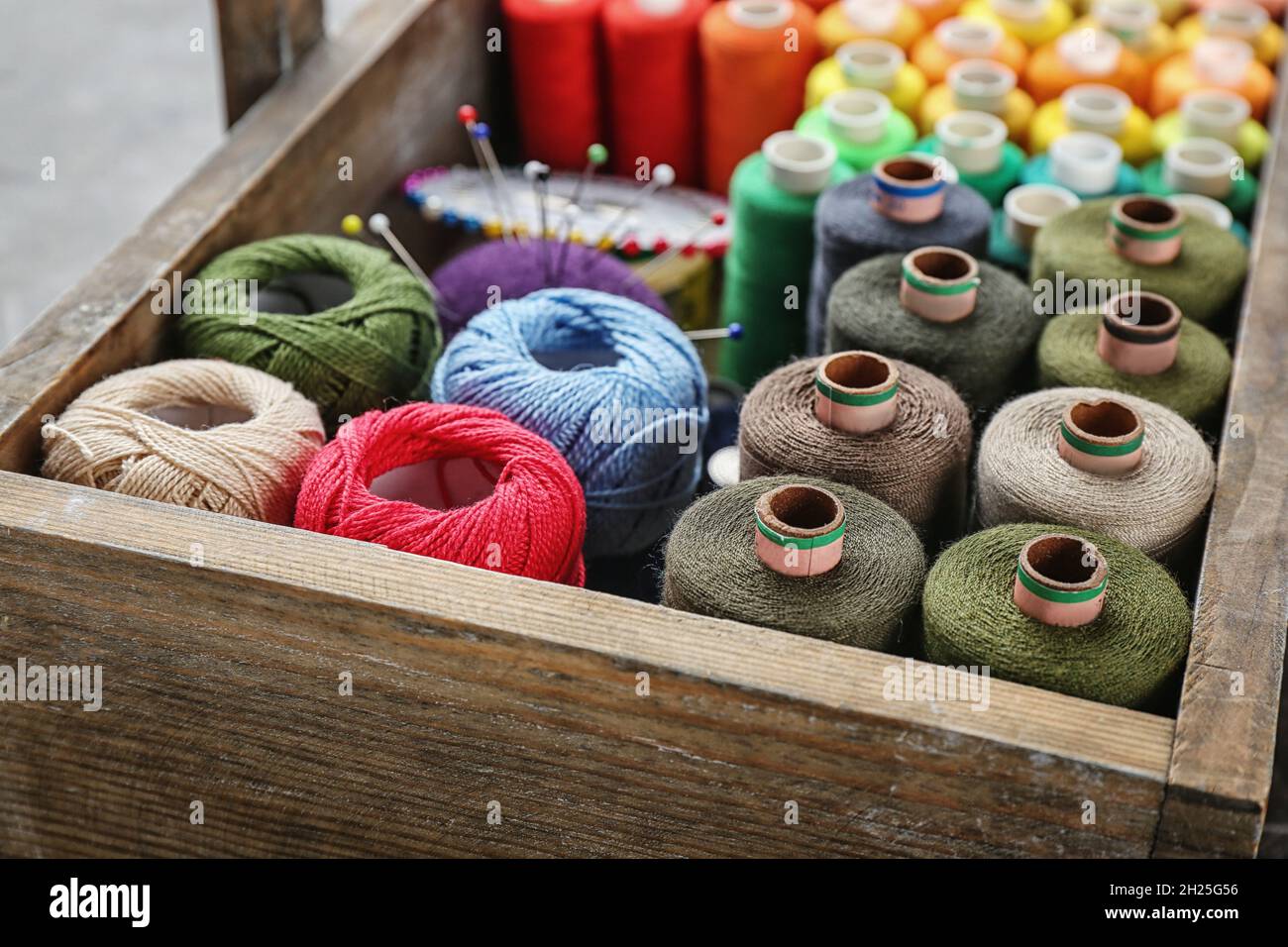Box with color sewing threads, closeup Stock Photo - Alamy