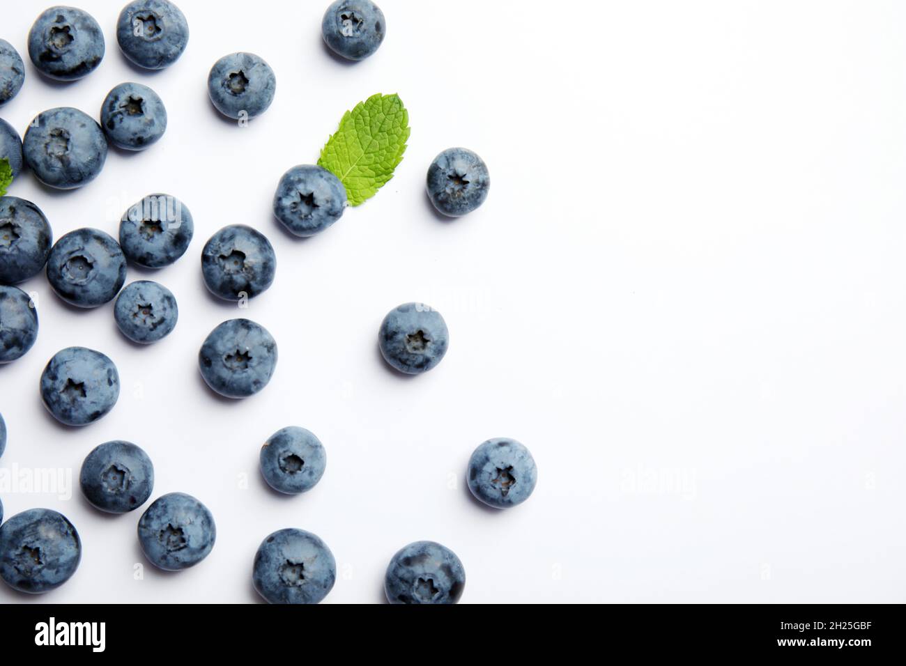 Flat lay composition with tasty blueberry and space for text on white ...