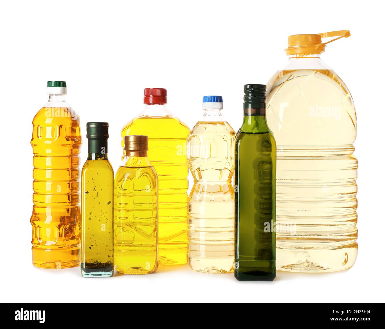 Bottles with different oils on white background Stock Photo - Alamy