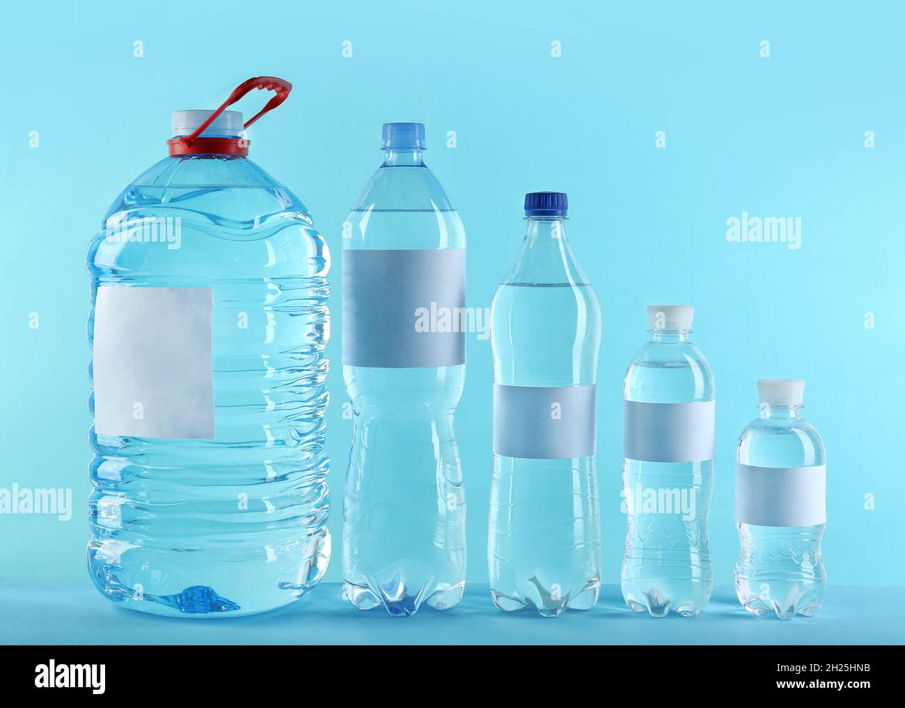 Plastic bottles water different size hi-res stock photography and ...