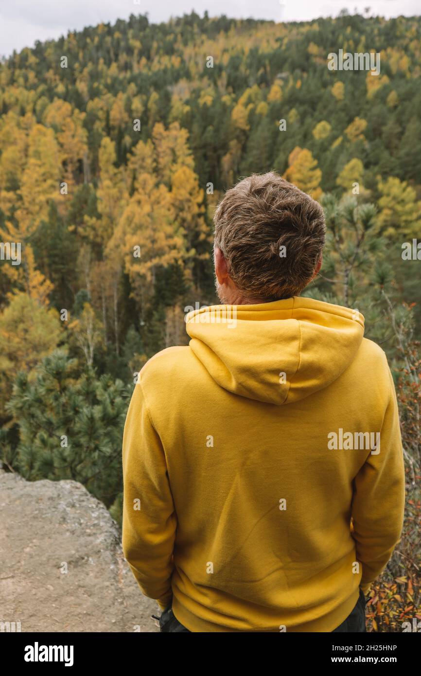 Man standing behind tree in hi-res stock photography and images - Alamy
