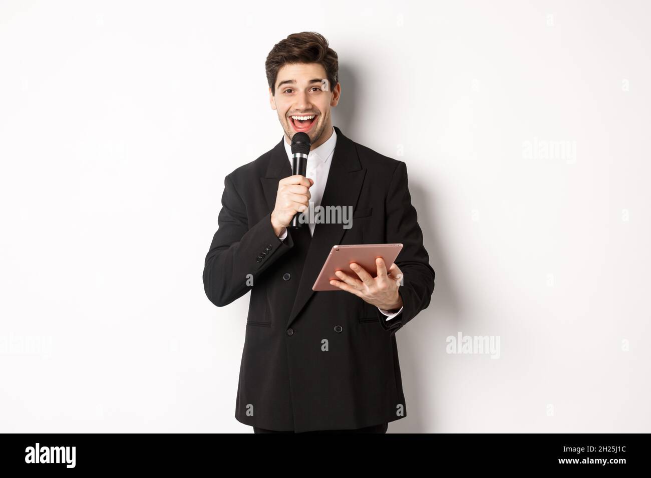 Image of handsome male performer, giving a speech, entertain people at ...